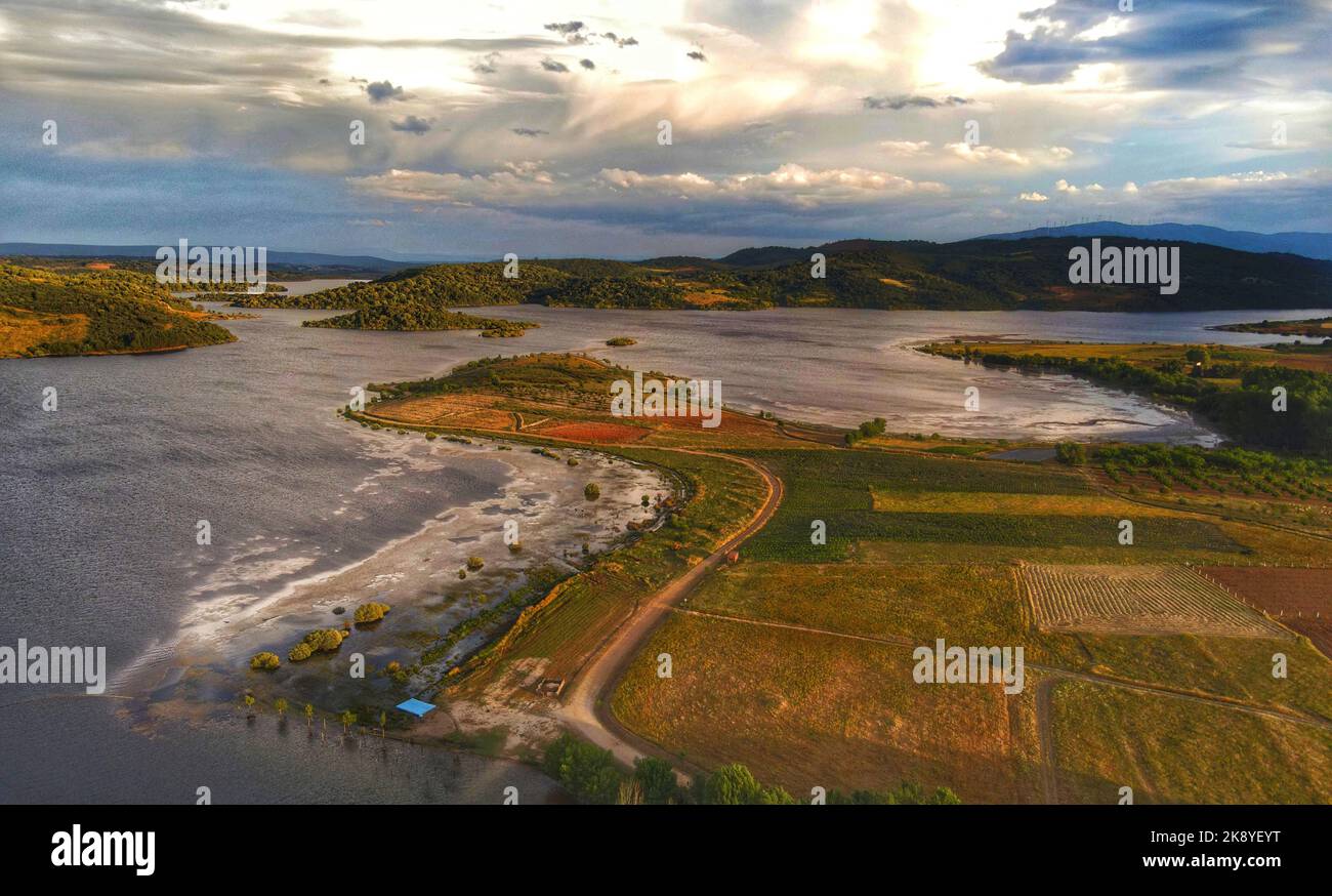 A huge river flowing through agricultural fields, aerial Stock Photo ...