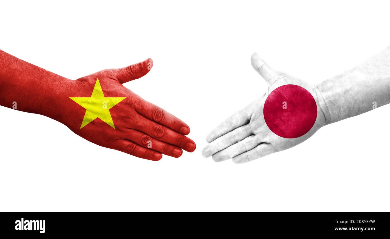 Handshake between Japan and Vietnam flags painted on hands, isolated ...
