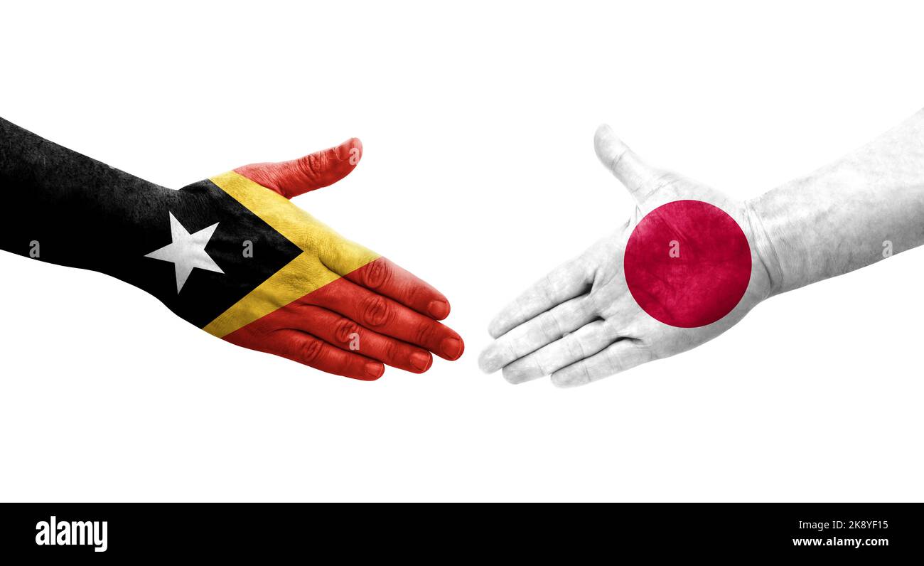 Handshake between Japan and Timor Leste flags painted on hands ...