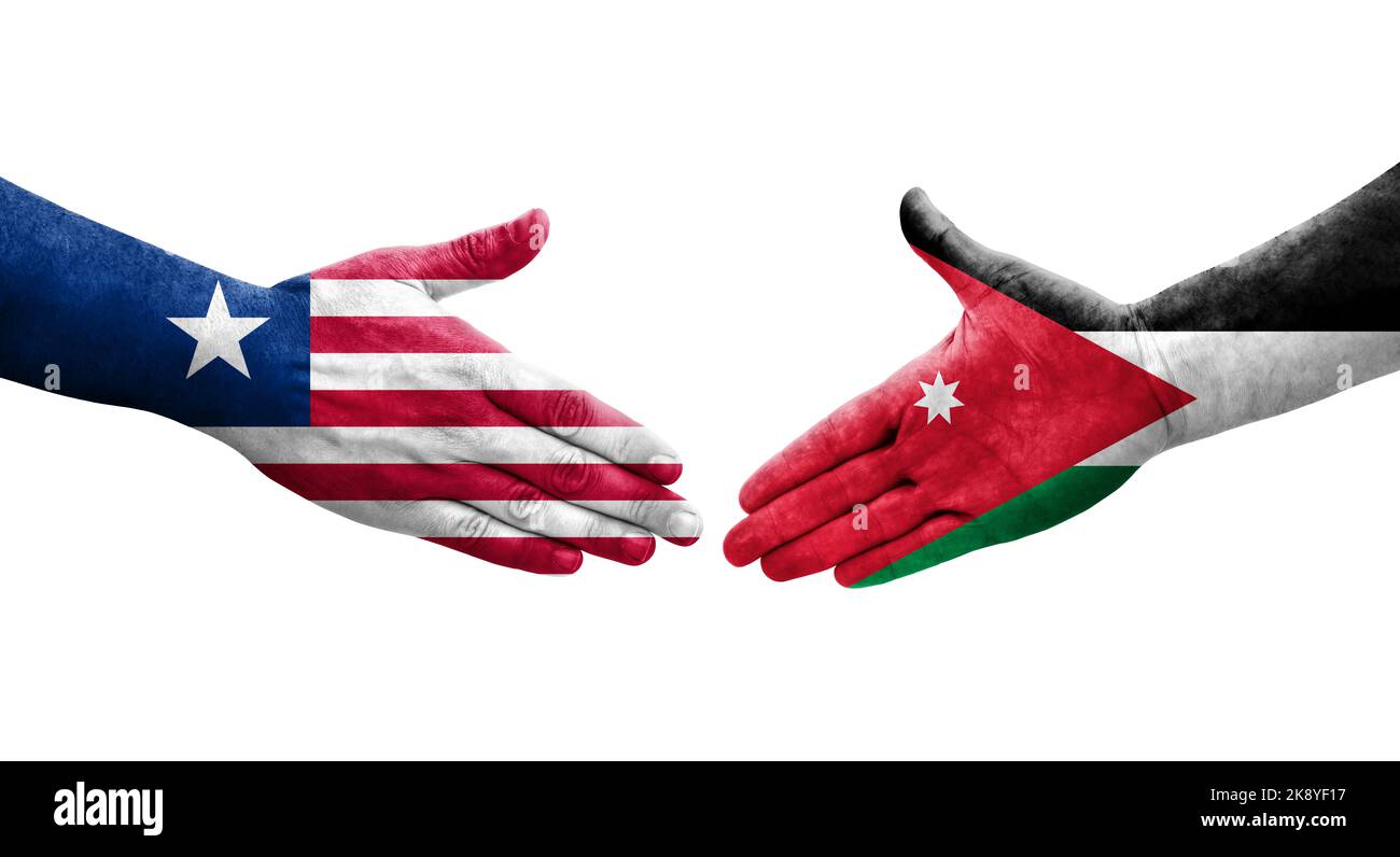 Handshake between Jordan and Liberia flags painted on hands, isolated ...
