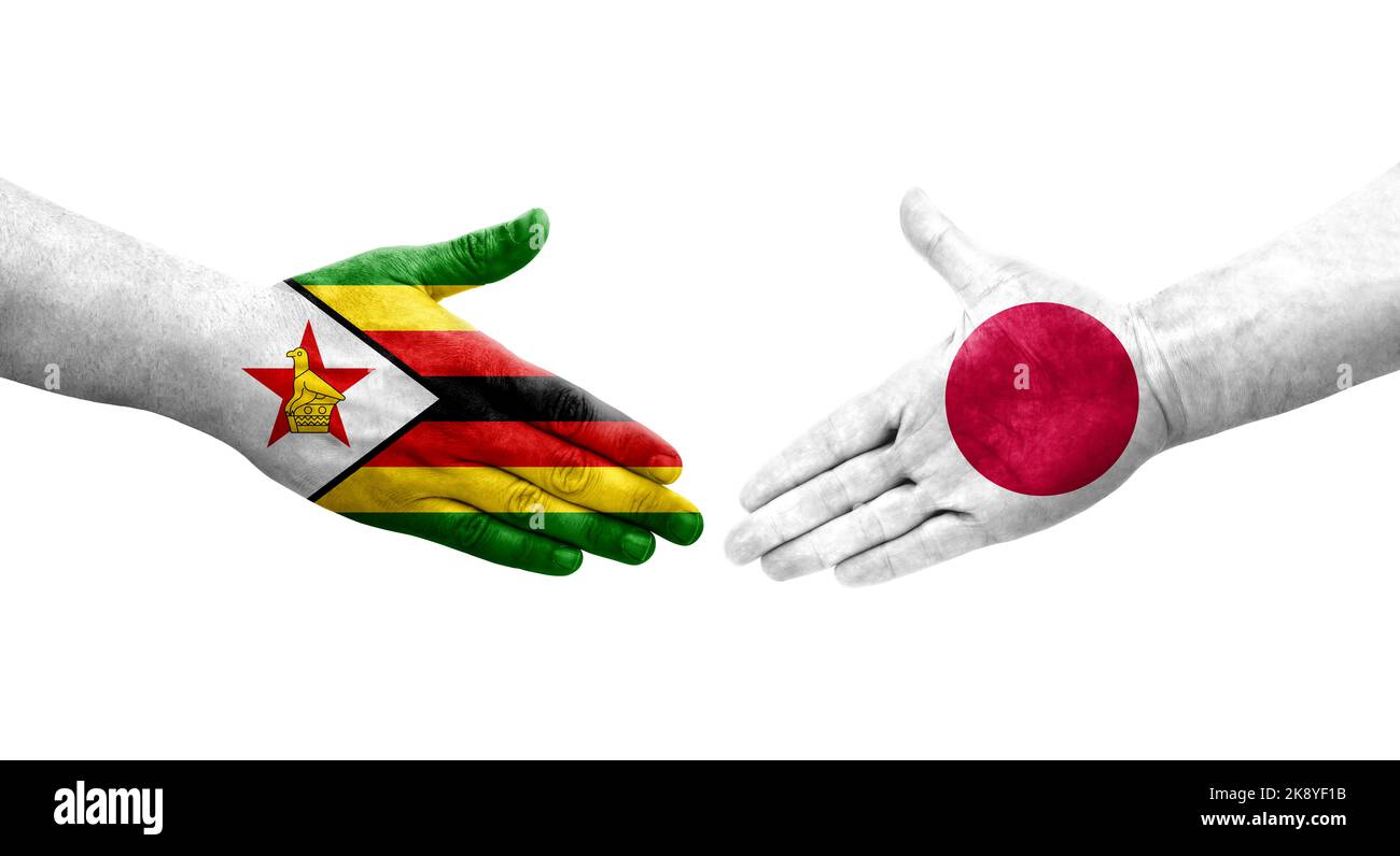 Handshake between Japan and Zimbabwe flags painted on hands, isolated ...