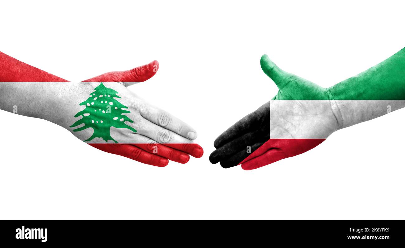 Handshake between Kuwait and Lebanon flags painted on hands, isolated ...