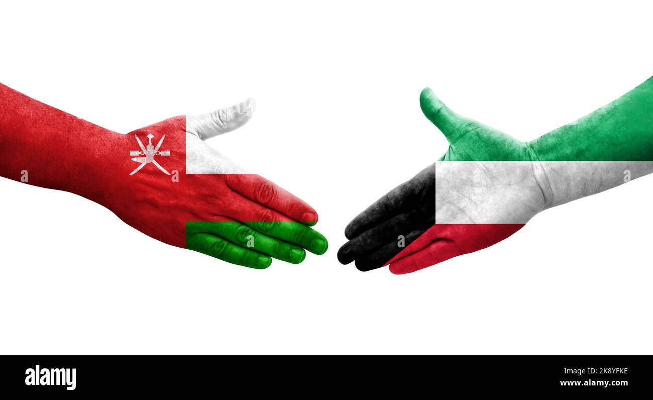 Handshake between Kuwait and Oman flags painted on hands, isolated ...