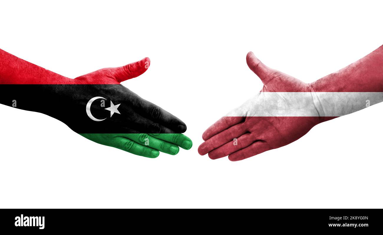Handshake between Latvia and Libya flags painted on hands, isolated ...