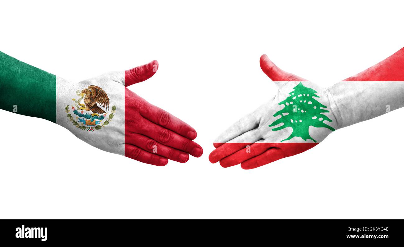 Handshake between Lebanon and Mexico flags painted on hands, isolated ...