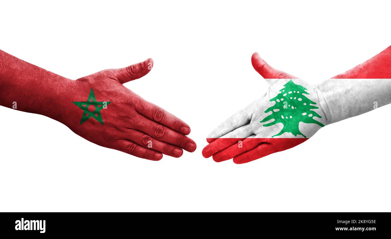 Handshake between Lebanon and Morocco flags painted on hands, isolated ...