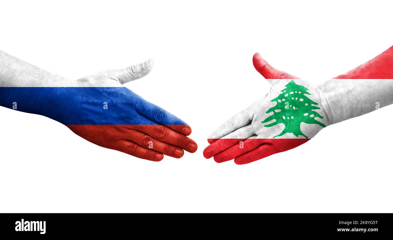 Handshake between Lebanon and Russia flags painted on hands, isolated ...