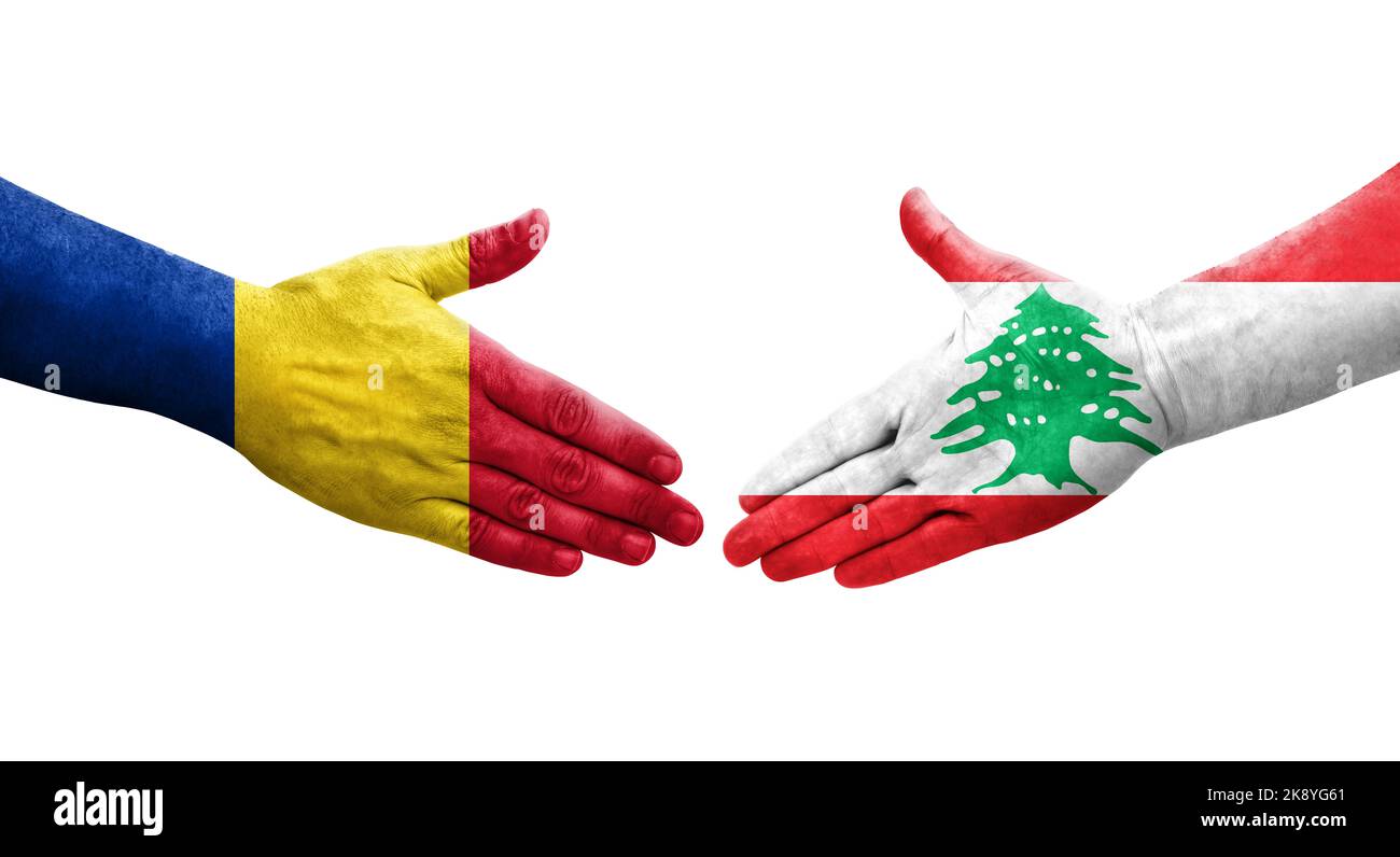 Handshake between Lebanon and Romania flags painted on hands, isolated ...