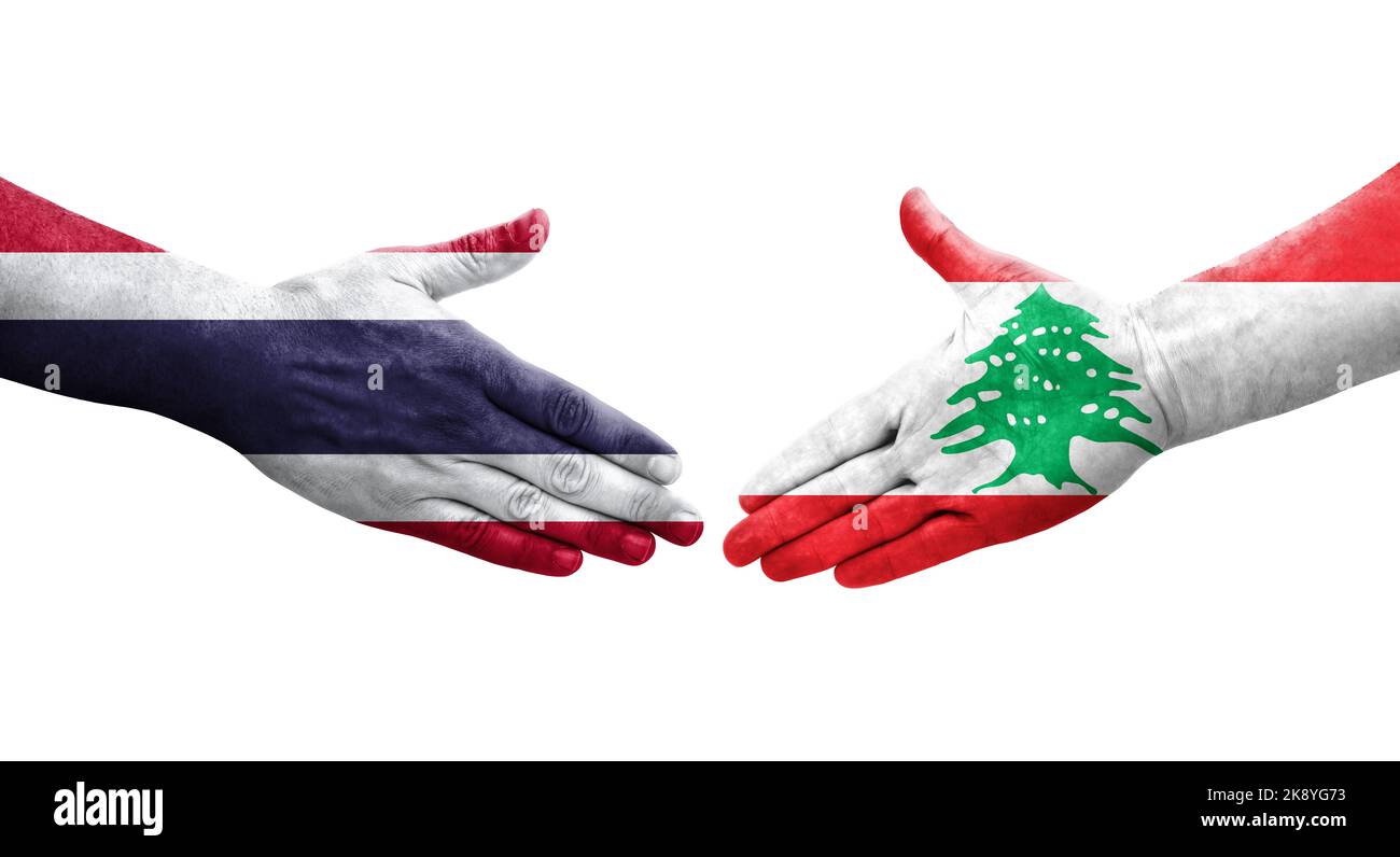 Handshake between Lebanon and Thailand flags painted on hands, isolated ...