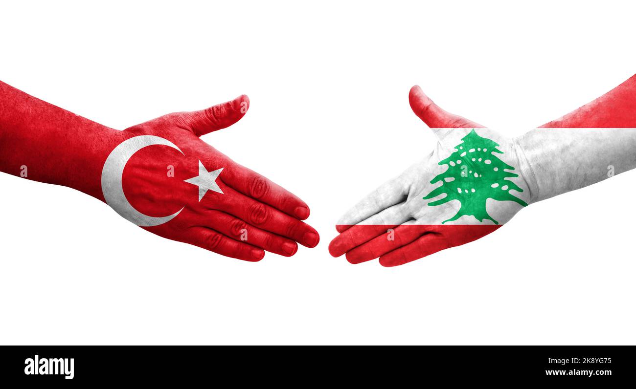 Handshake between Lebanon and Turkey flags painted on hands, isolated ...