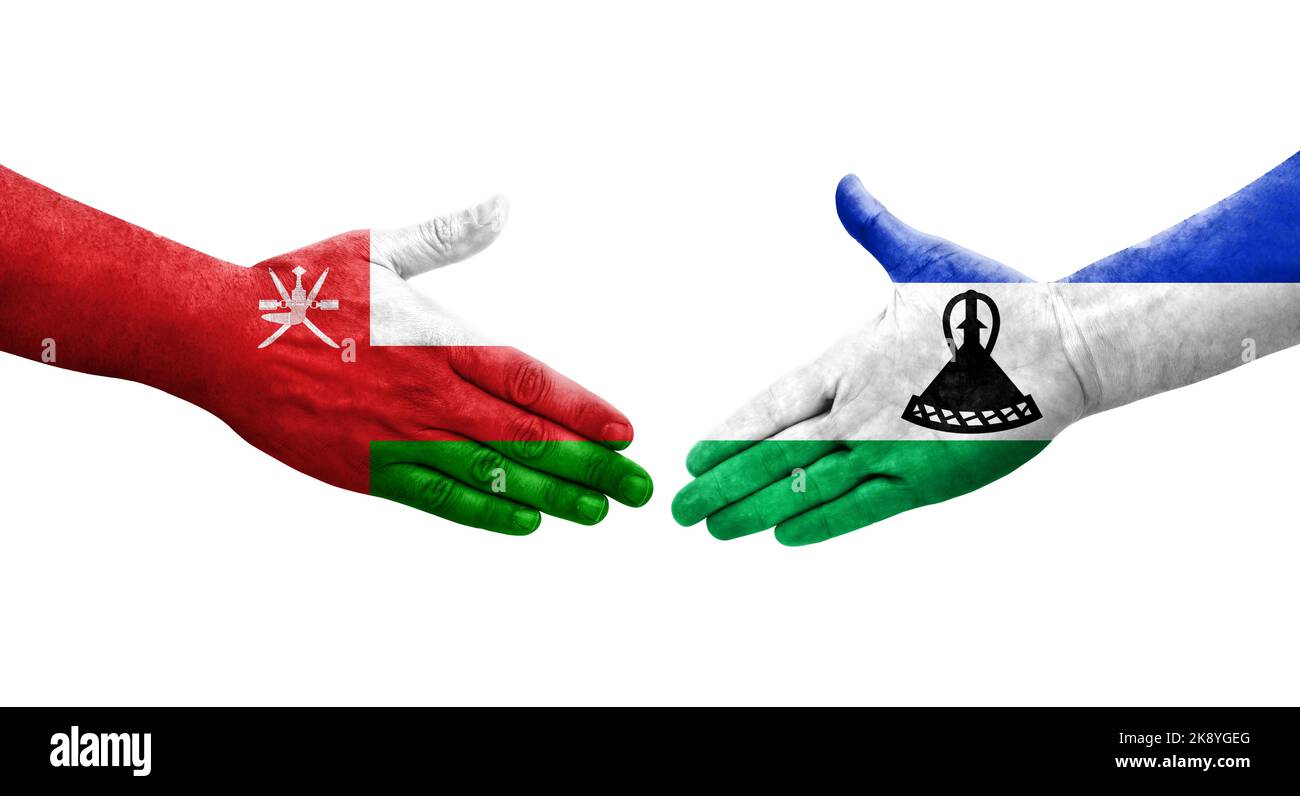Handshake between Lesotho and Oman flags painted on hands, isolated ...