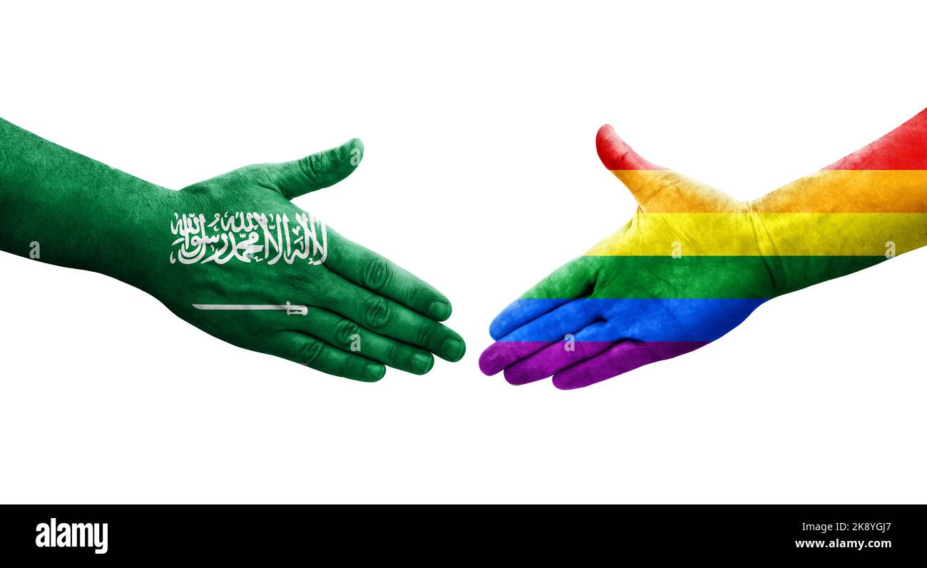 Handshake between LGBT and Saudi Arabia flags painted on hands ...