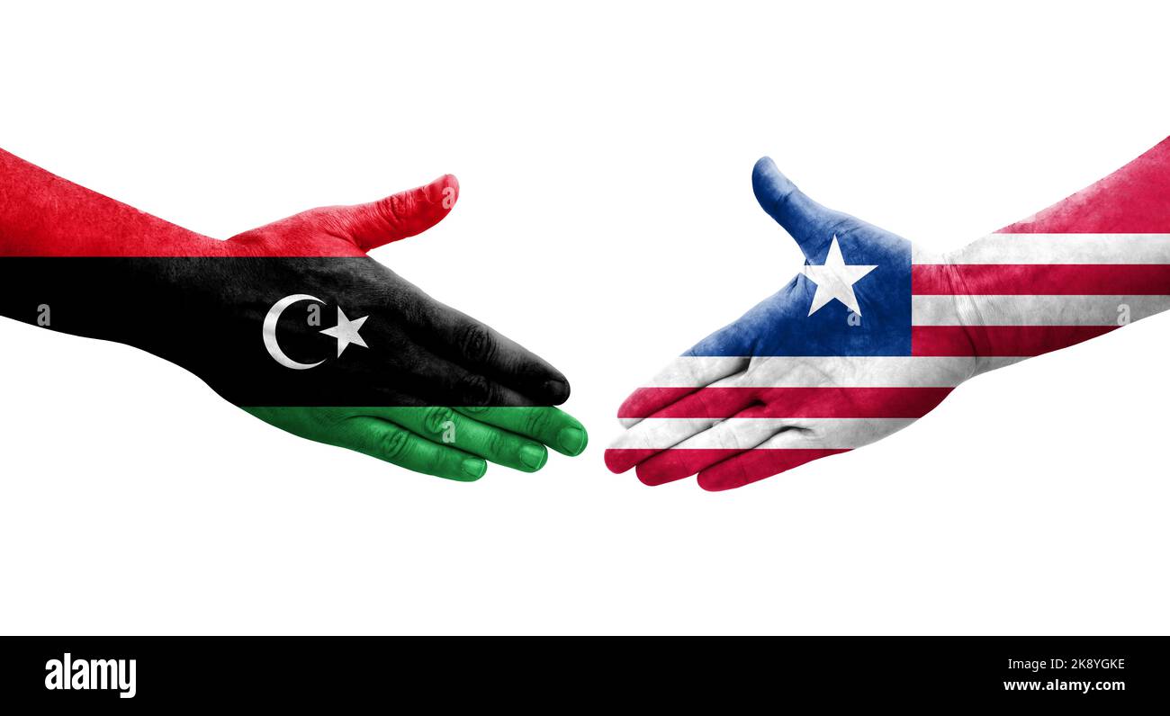 Handshake between Liberia and Libya flags painted on hands, isolated ...