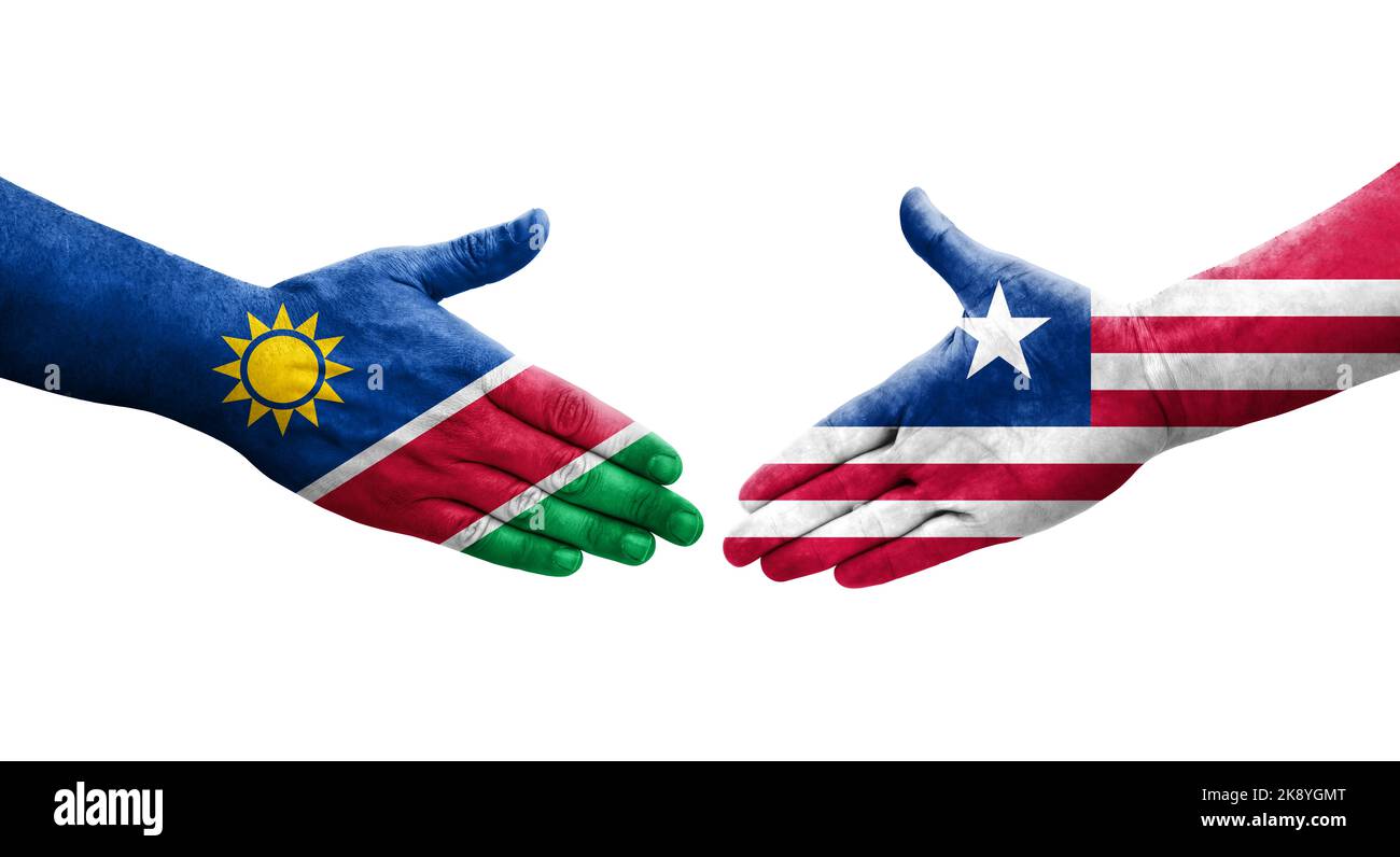 Handshake between Liberia and Namibia flags painted on hands, isolated ...