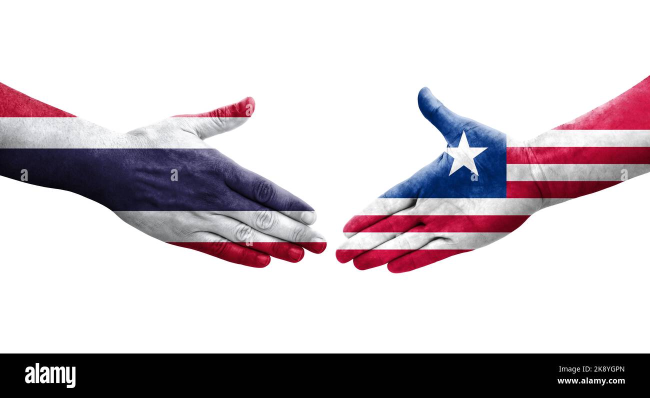 Handshake between Liberia and Thailand flags painted on hands, isolated ...