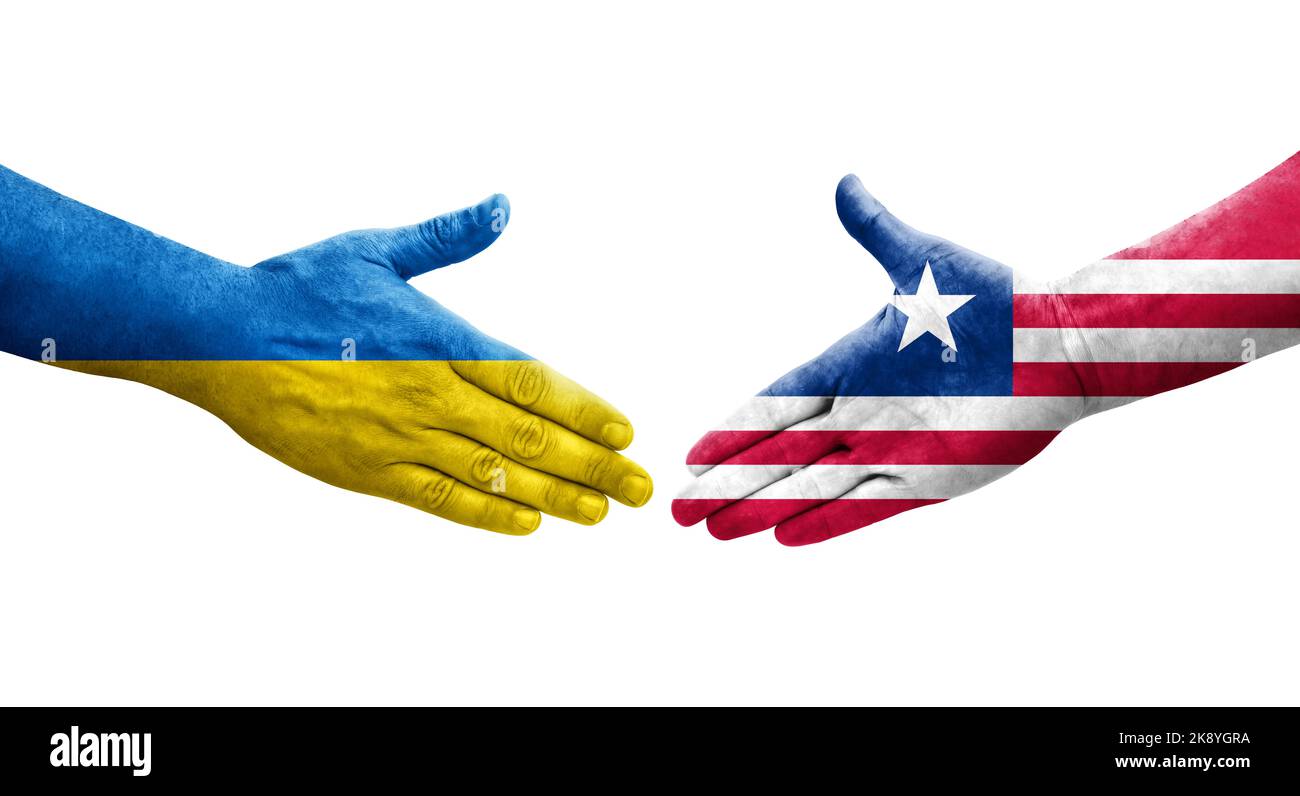 Handshake between Liberia and Ukraine flags painted on hands, isolated ...