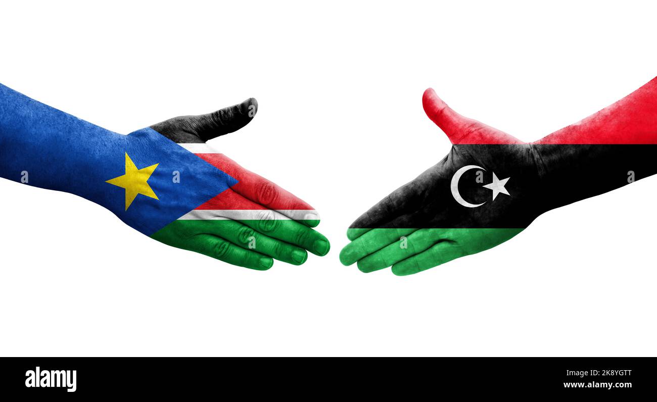 Handshake between Libya and South Sudan flags painted on hands ...