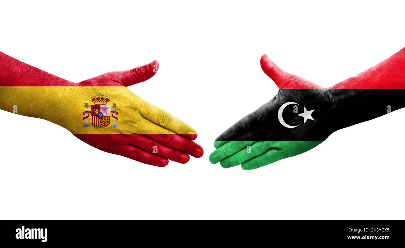 Handshake between Libya and Spain flags painted on hands, isolated ...