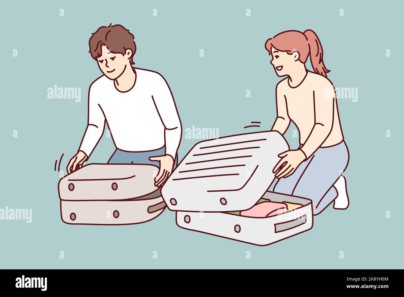 Happy couple packing suitcase getting ready for vacation. Smiling man ...