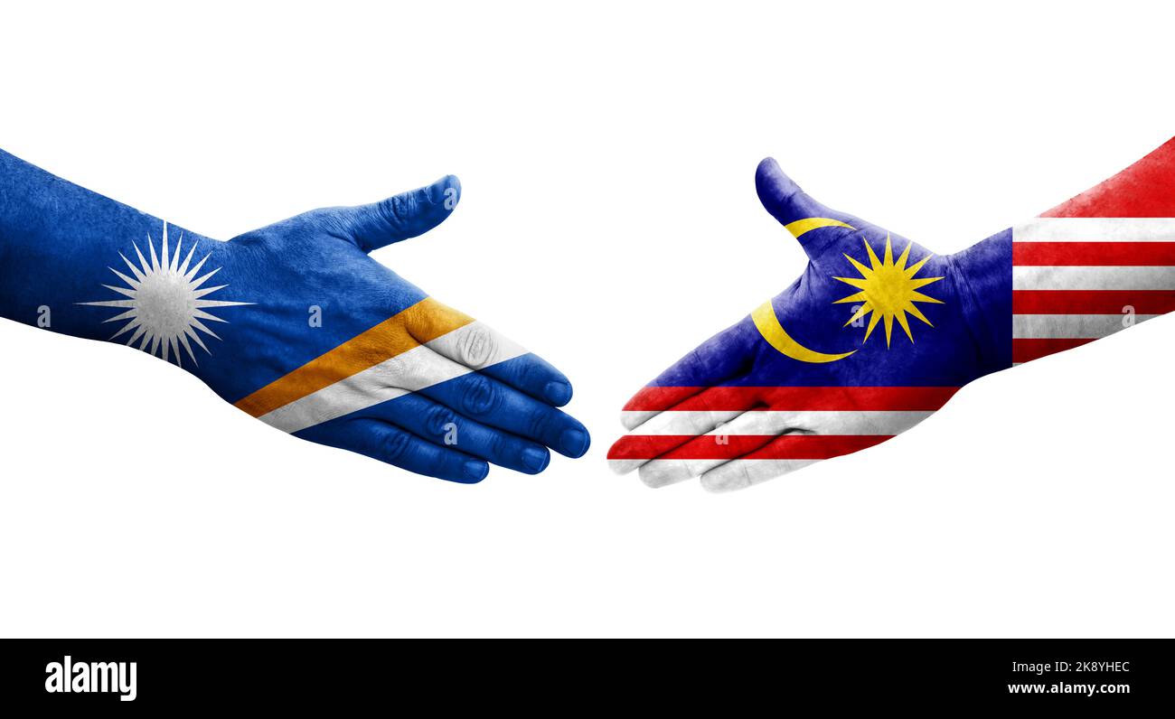 Handshake between Malaysia and Marshall Islands flags painted on hands ...