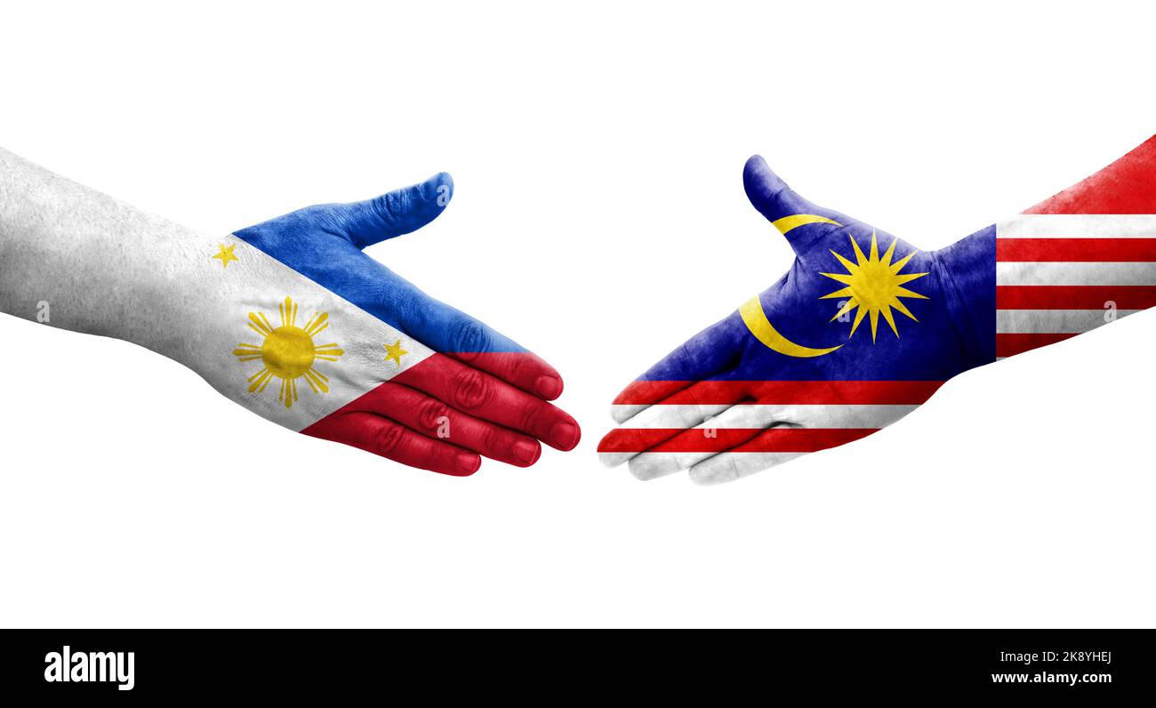 Handshake between Malaysia and Philippines flags painted on hands ...