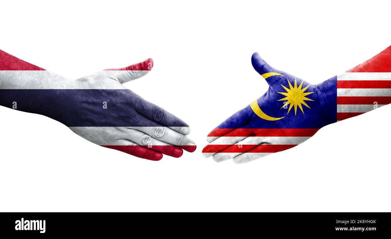 Handshake between Malaysia and Thailand flags painted on hands ...