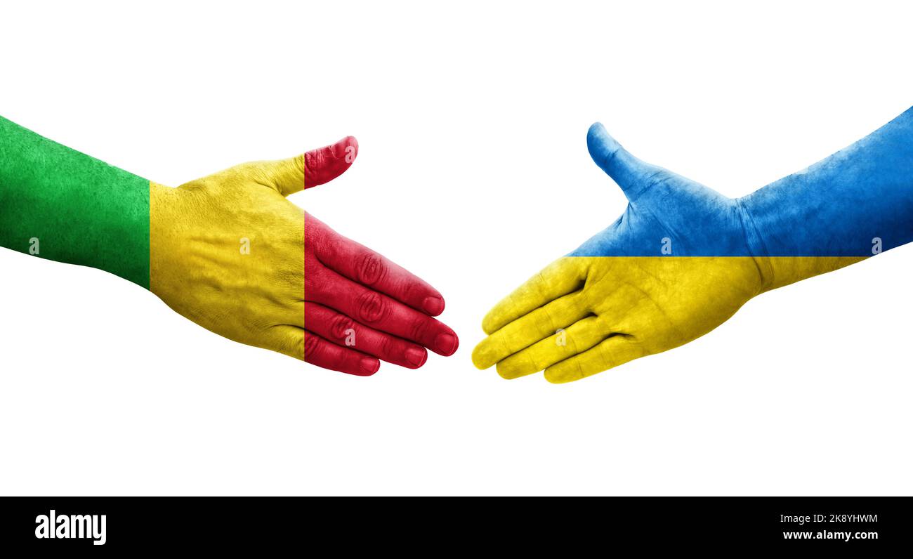 Handshake between Mali and Ukraine flags painted on hands, isolated ...
