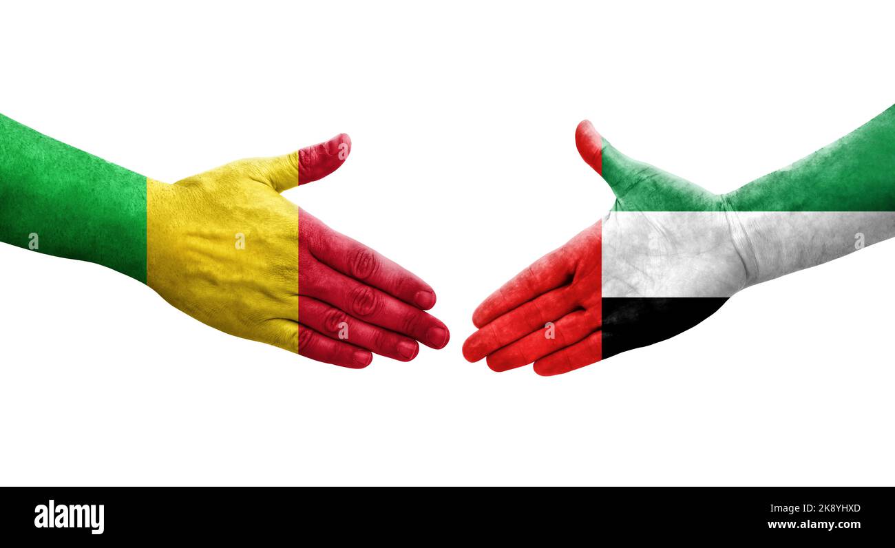 Handshake between Mali and UAE flags painted on hands, isolated ...