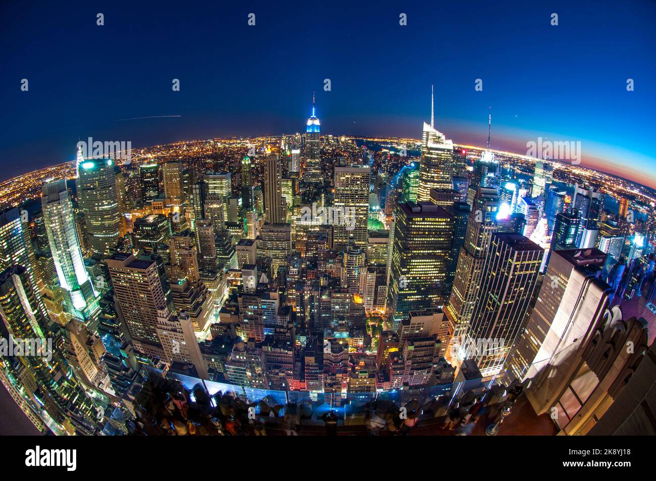 An aerial view of cityscape New York surrounded by buildings in evening ...