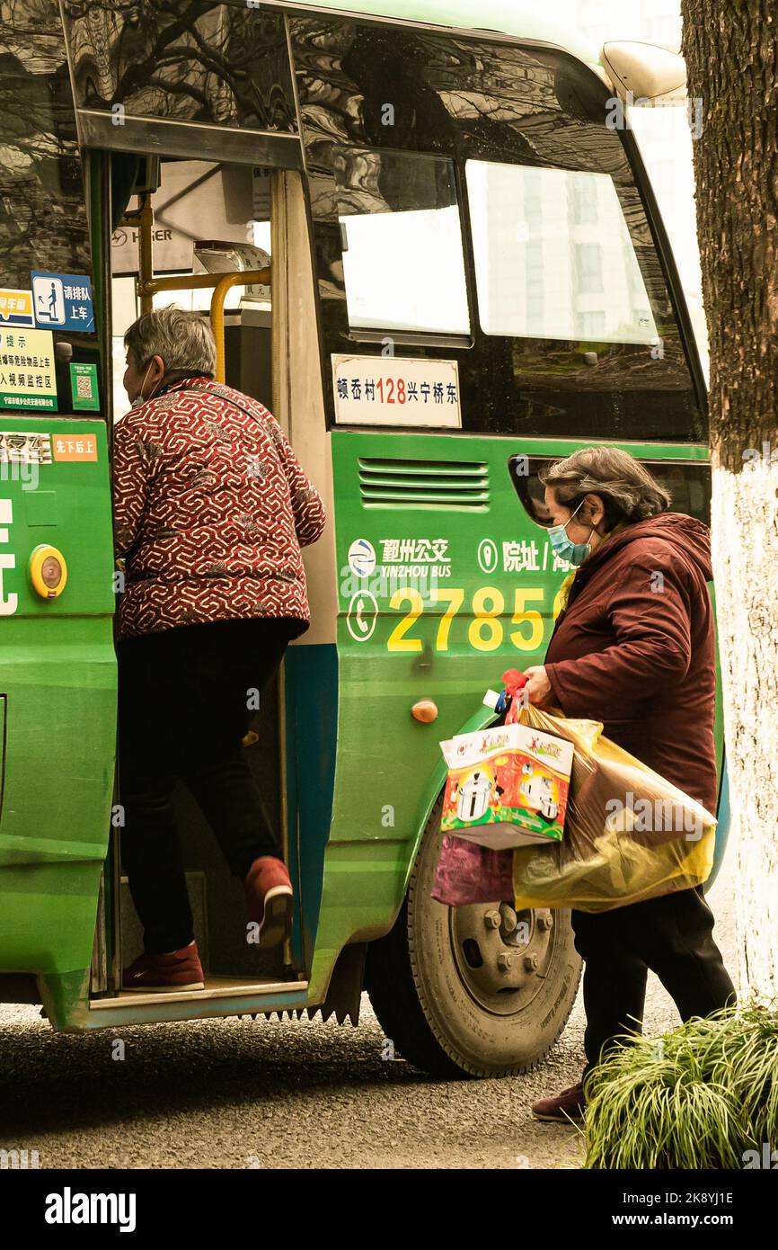 Two women getting on bus hi-res stock photography and images - Alamy