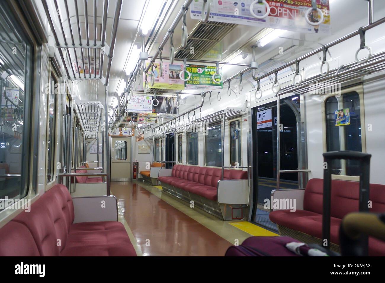 View of interior of empty Japanese train wagon stop at platform of ...
