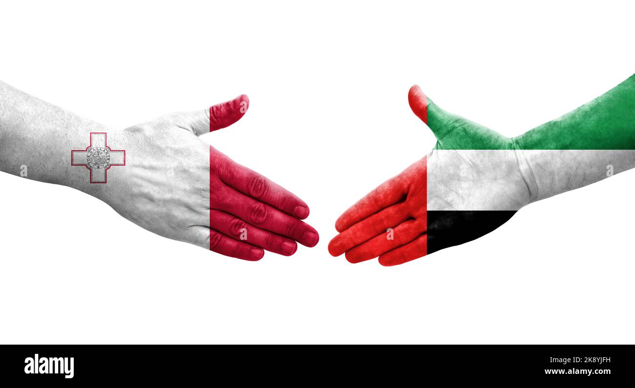 Handshake between Malta and UAE flags painted on hands, isolated ...