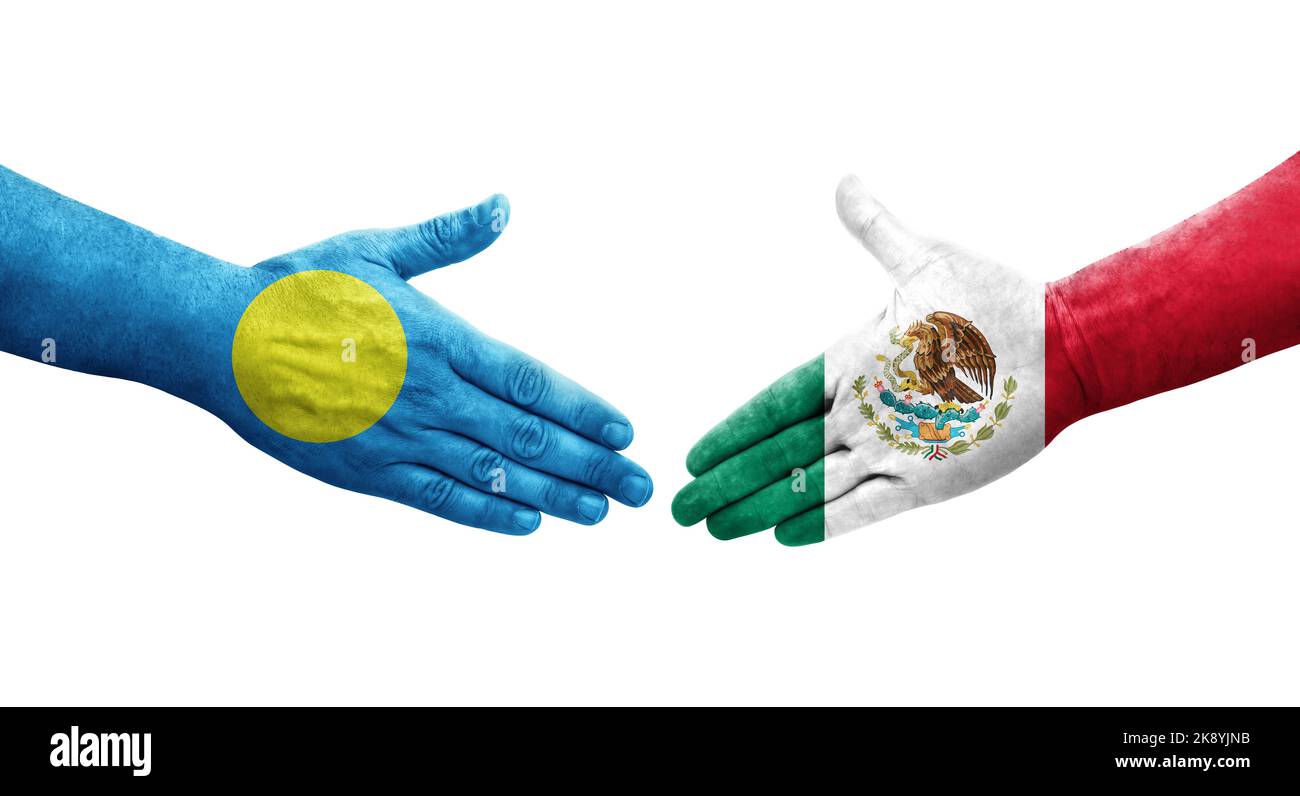 Handshake between Mexico and Palau flags painted on hands, isolated ...