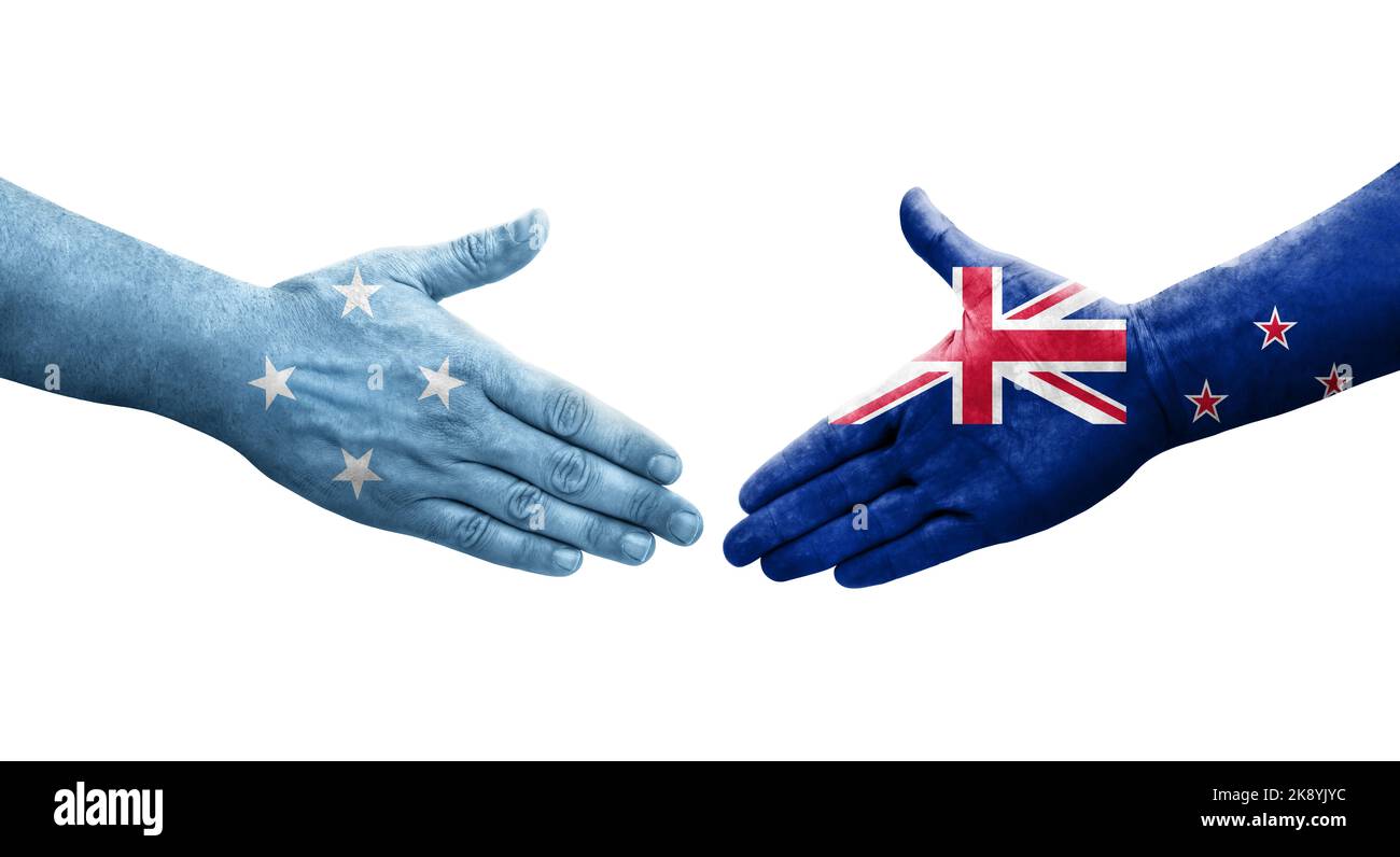 Handshake between Micronesia and New Zealand flags painted on hands ...