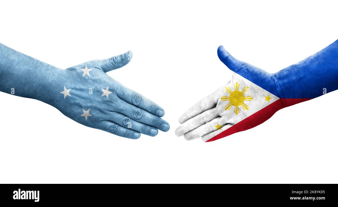Handshake between Micronesia and Philippines flags painted on hands ...