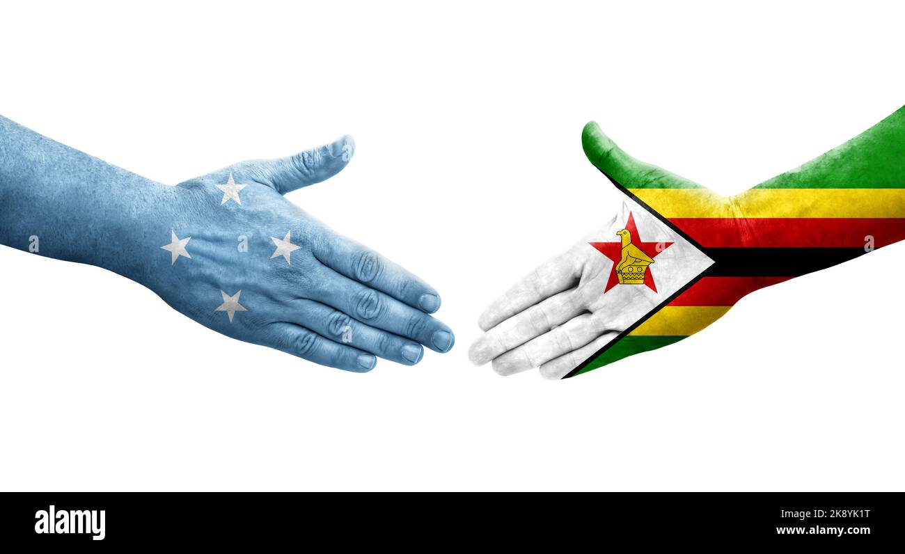 Handshake between Micronesia and Zimbabwe flags painted on hands ...