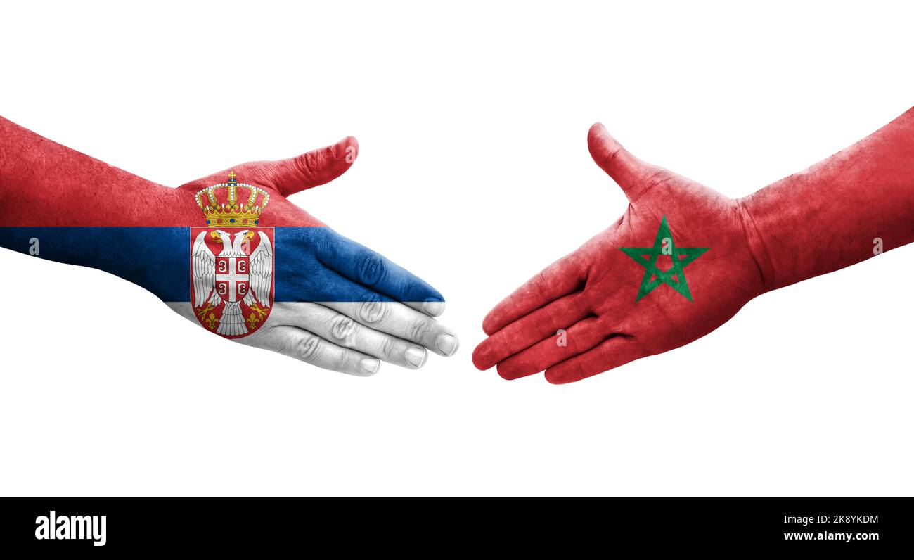 Handshake between Morocco and Serbia flags painted on hands, isolated ...