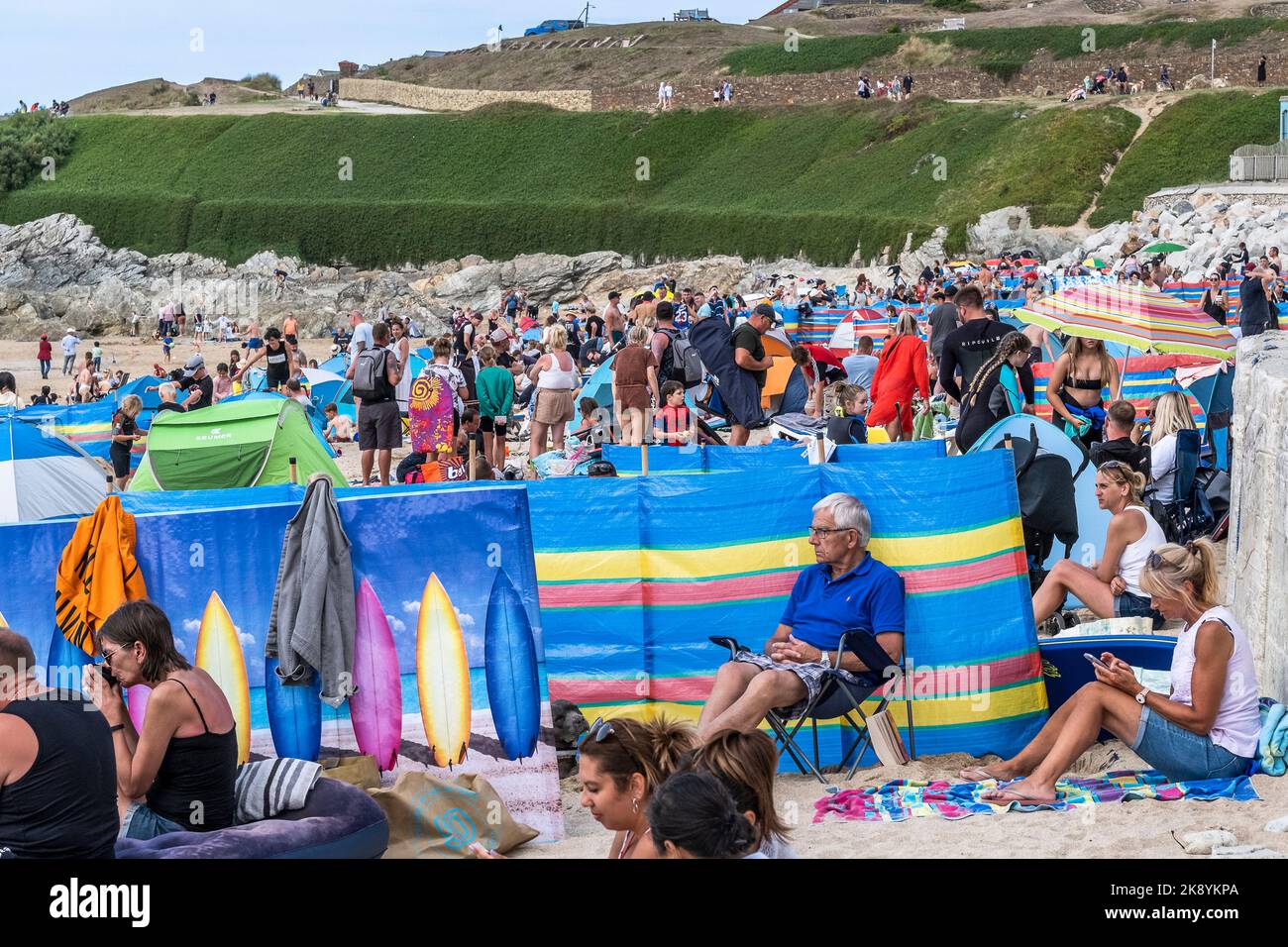 Holidaymakers on a busy crowded Fistral Beach in Newquay in Cornwall in ...