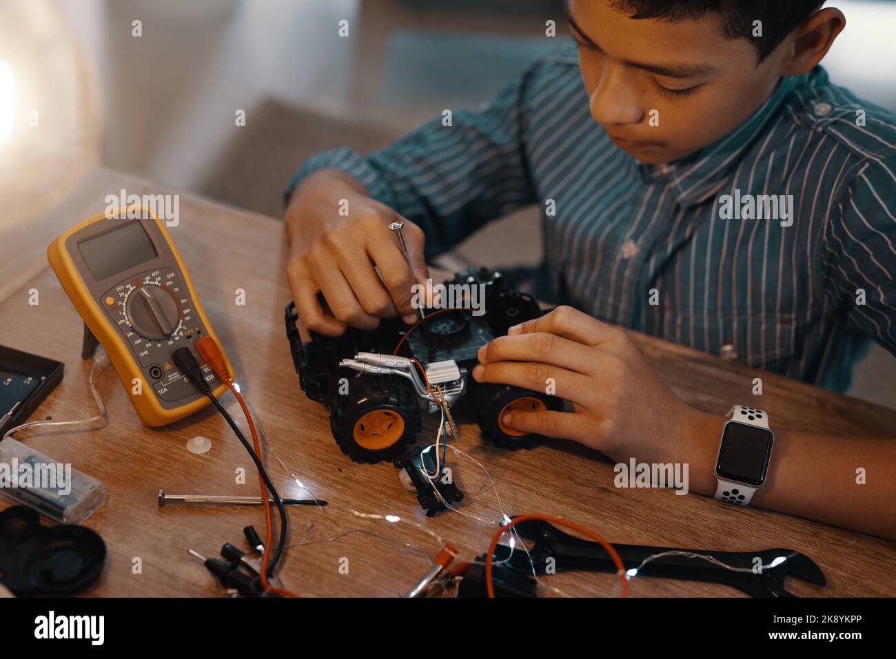 Every kid is a genius at something. a handsome young boy building a ...