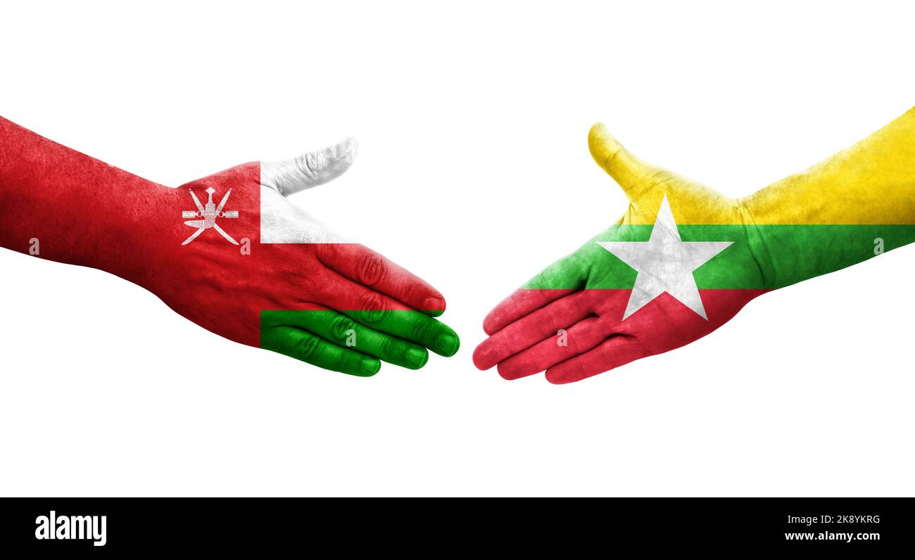 Handshake between Myanmar and Oman flags painted on hands, isolated ...
