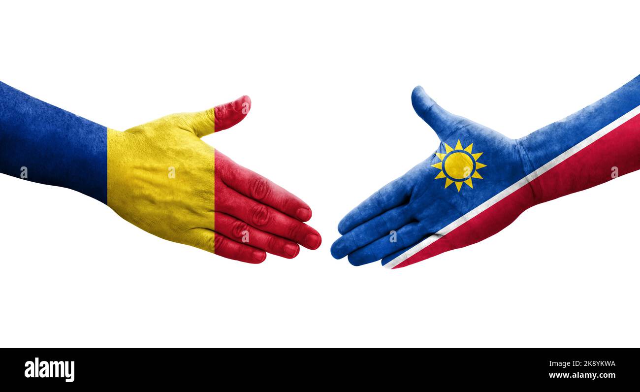 Handshake between Namibia and Romania flags painted on hands, isolated ...