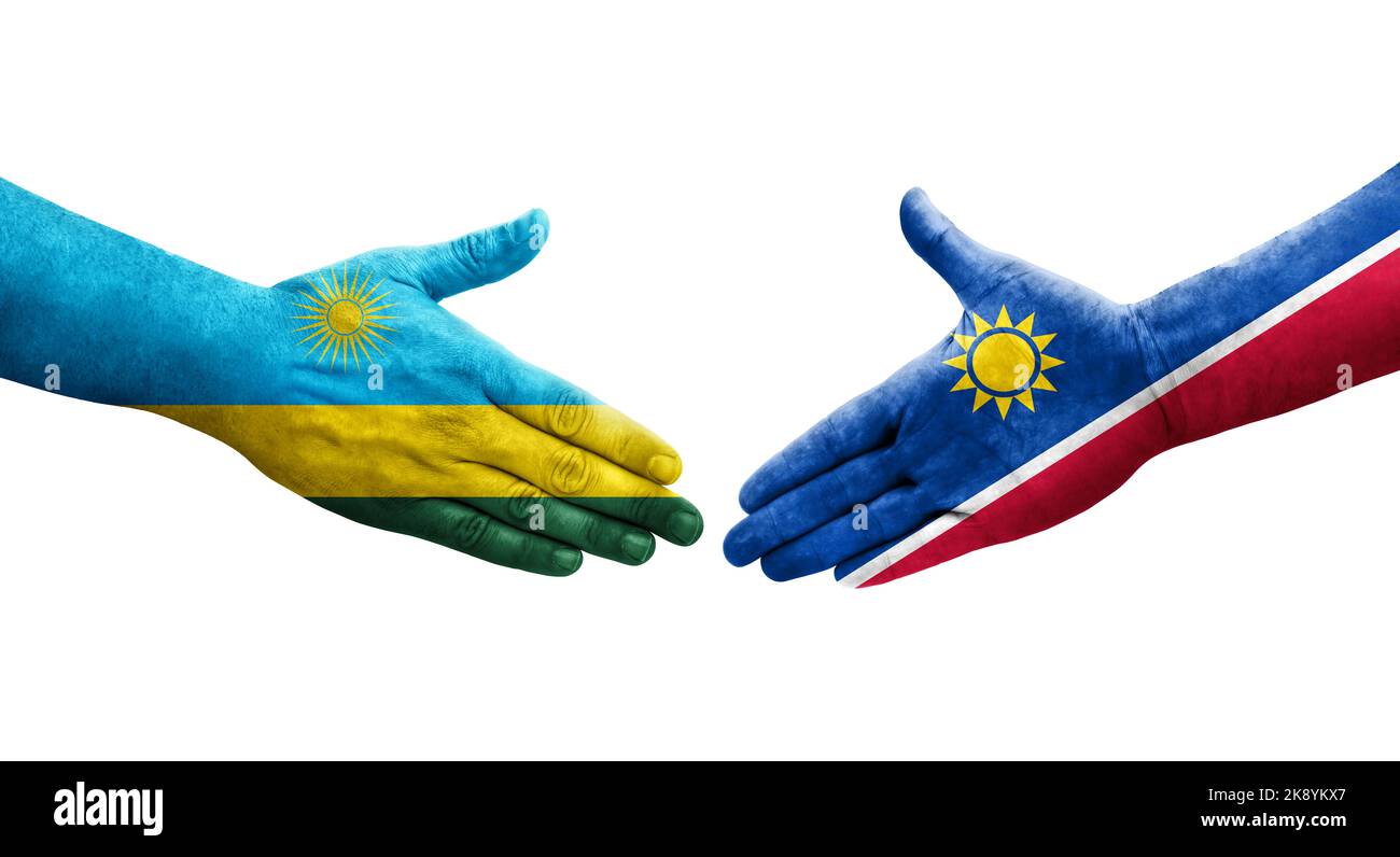 Handshake between Namibia and Rwanda flags painted on hands, isolated ...
