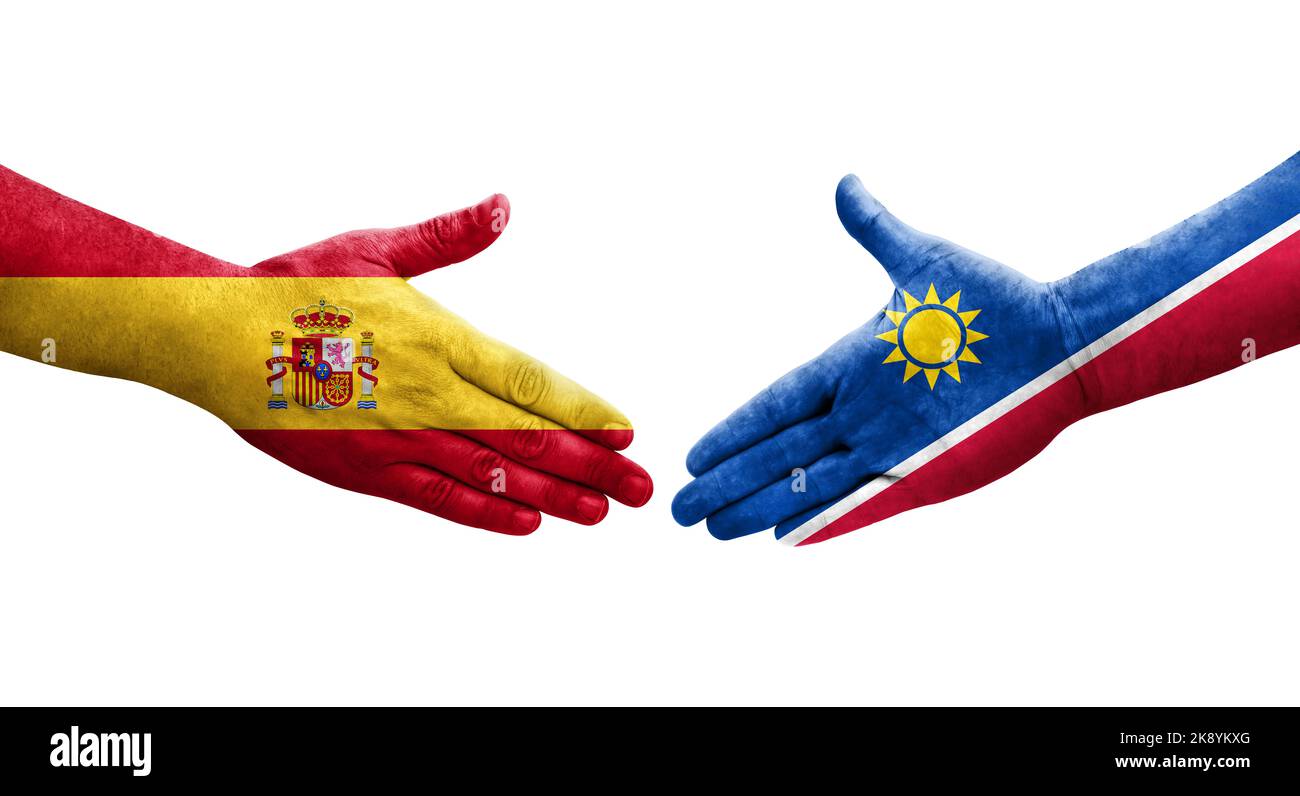 Handshake between Namibia and Spain flags painted on hands, isolated ...