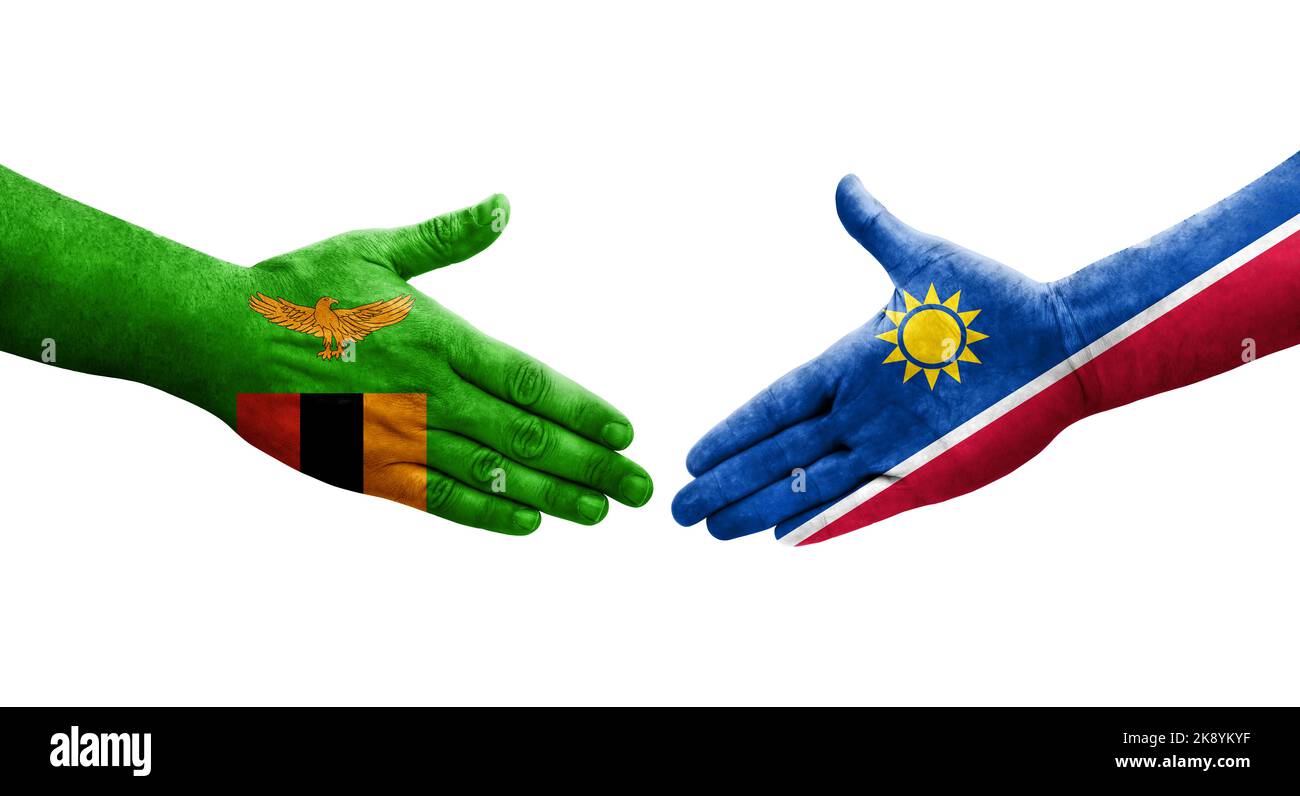 Handshake between Namibia and Zambia flags painted on hands, isolated ...