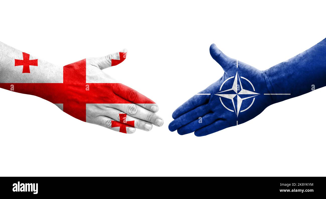 Handshake between Nato and Georgia flags painted on hands, isolated ...