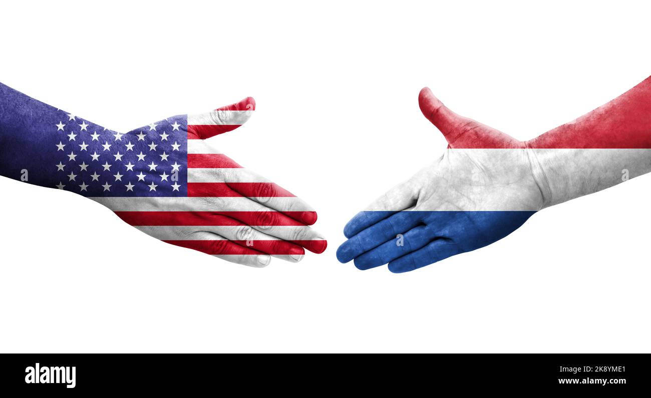 Handshake between Netherlands and USA flags painted on hands, isolated ...