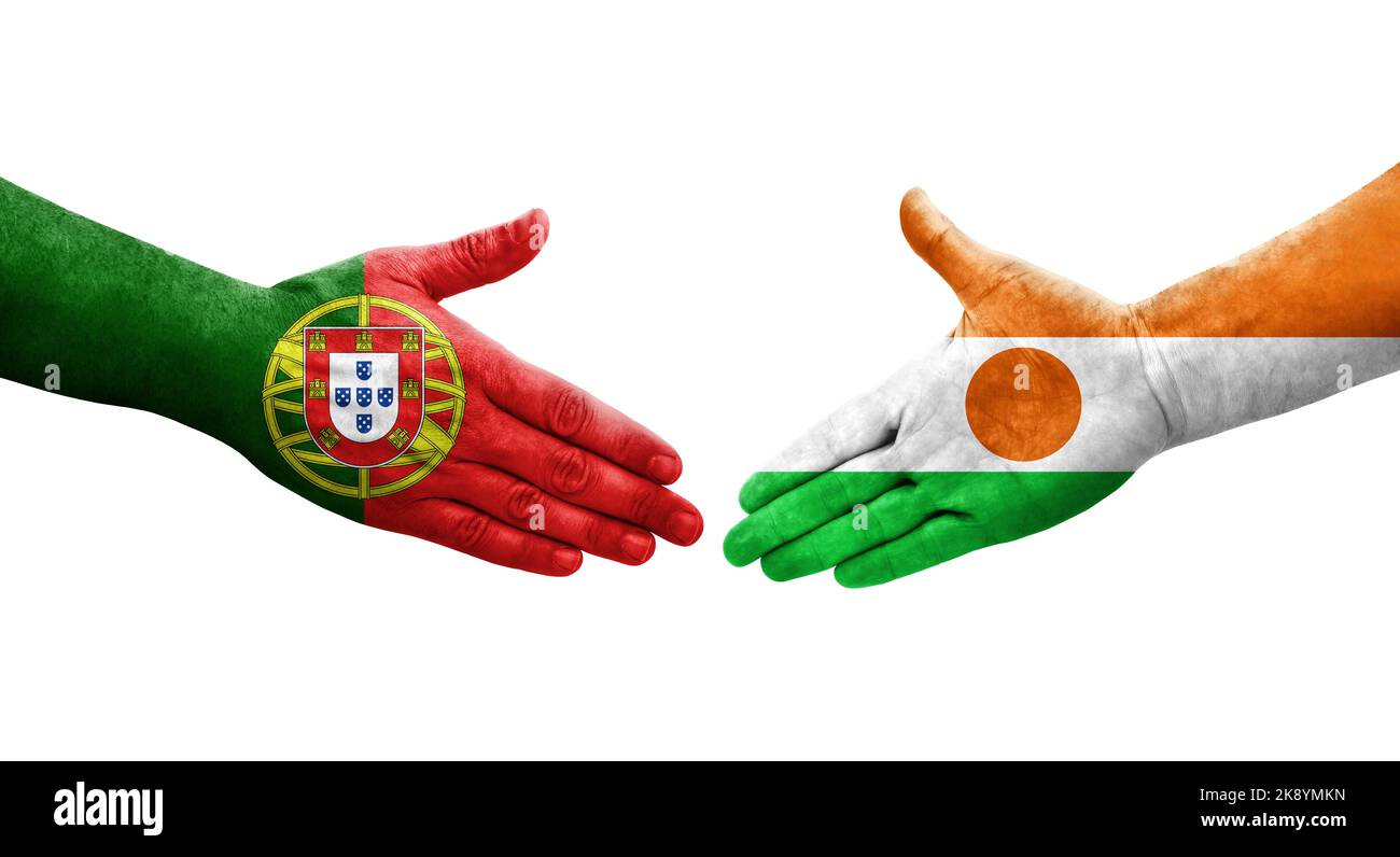 Handshake between Niger and Portugal flags painted on hands, isolated ...