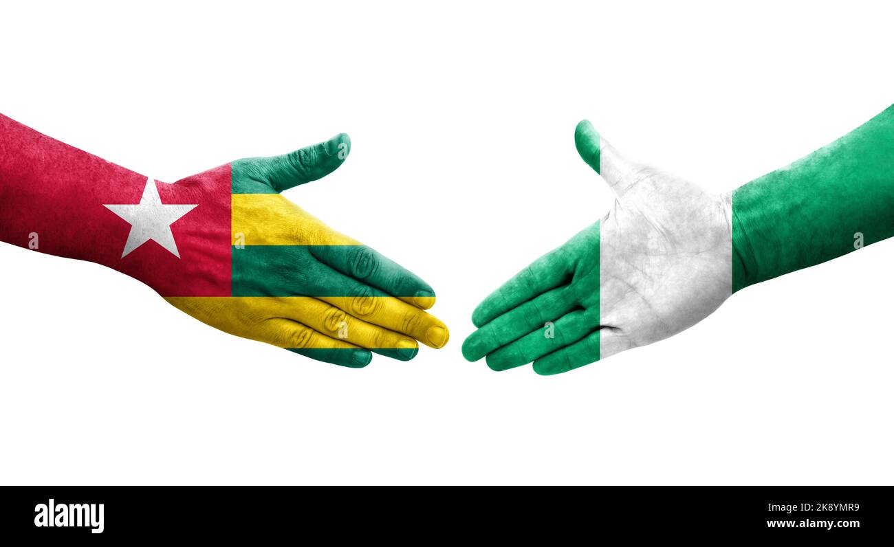 Handshake between Nigeria and Togo flags painted on hands, isolated ...