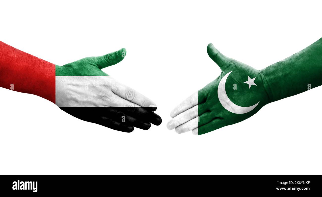 Handshake between Pakistan and UAE flags painted on hands, isolated ...