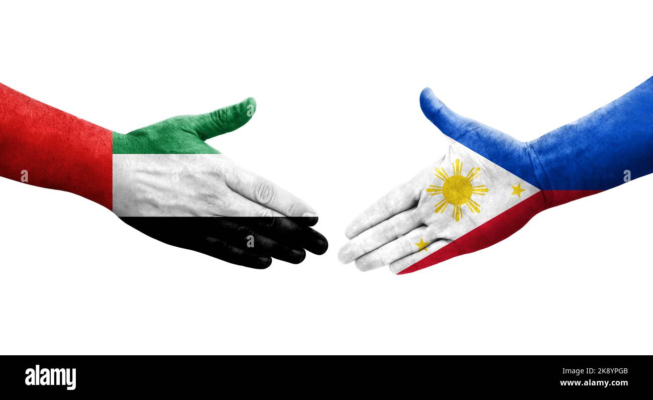 Handshake between Philippines and UAE flags painted on hands, isolated ...